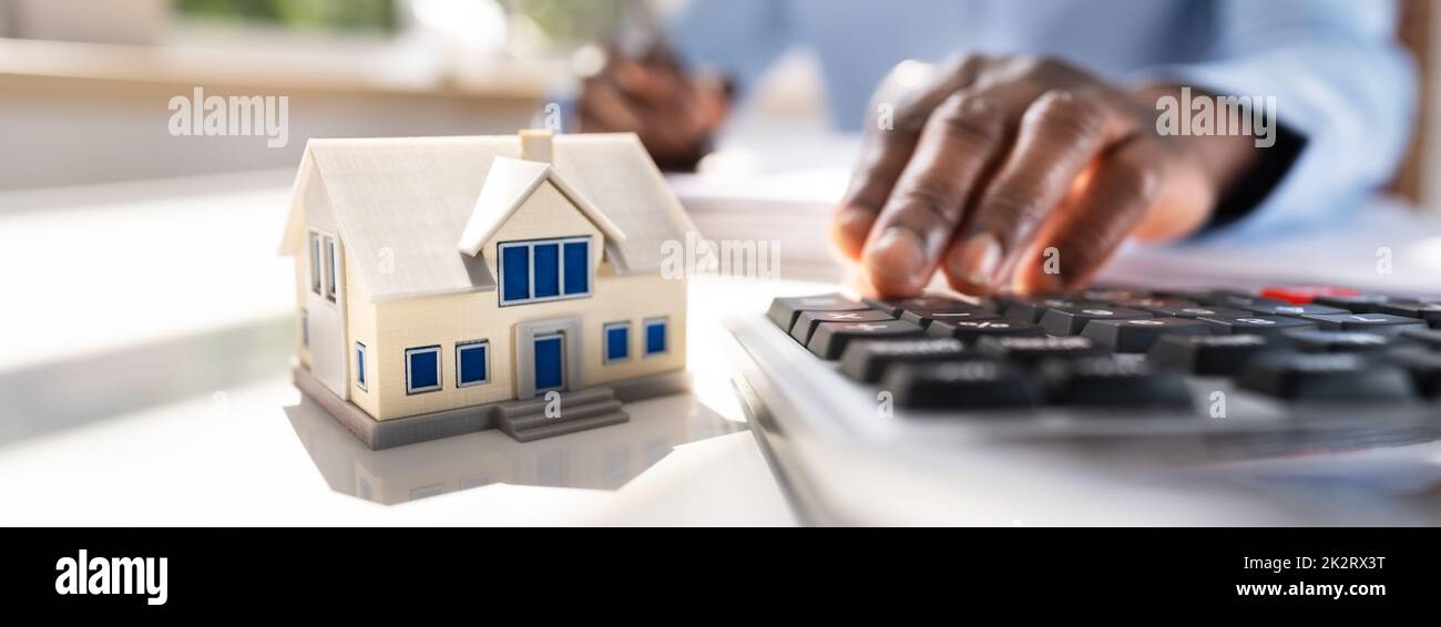 Businessman's Hand Calculating Invoice Stock Photo - Alamy