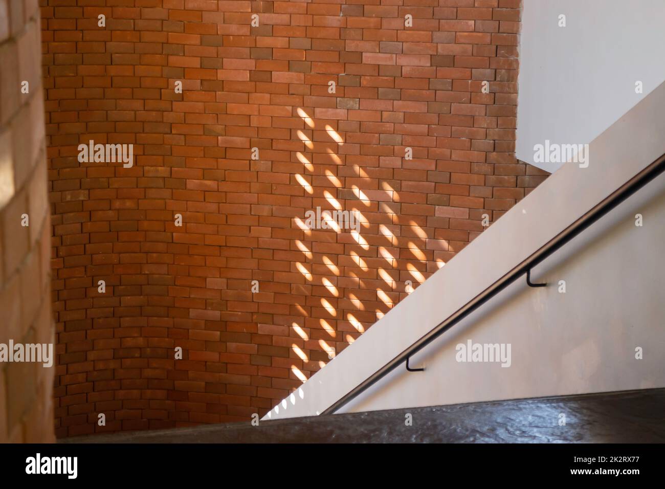 Brick wall trough to see light Stock Photo - Alamy