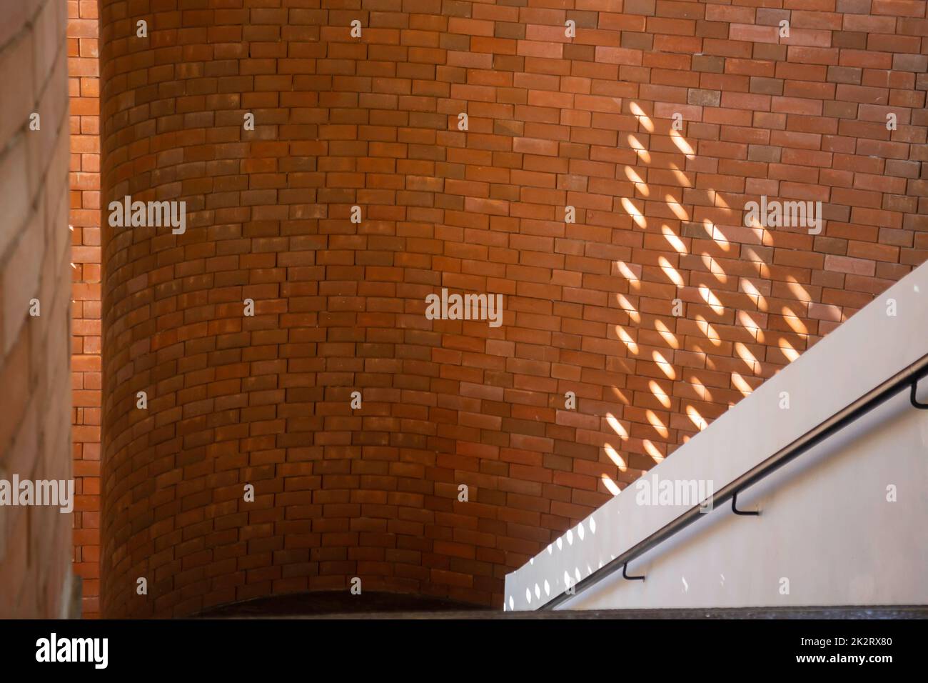 Brick wall trough to see light Stock Photo - Alamy