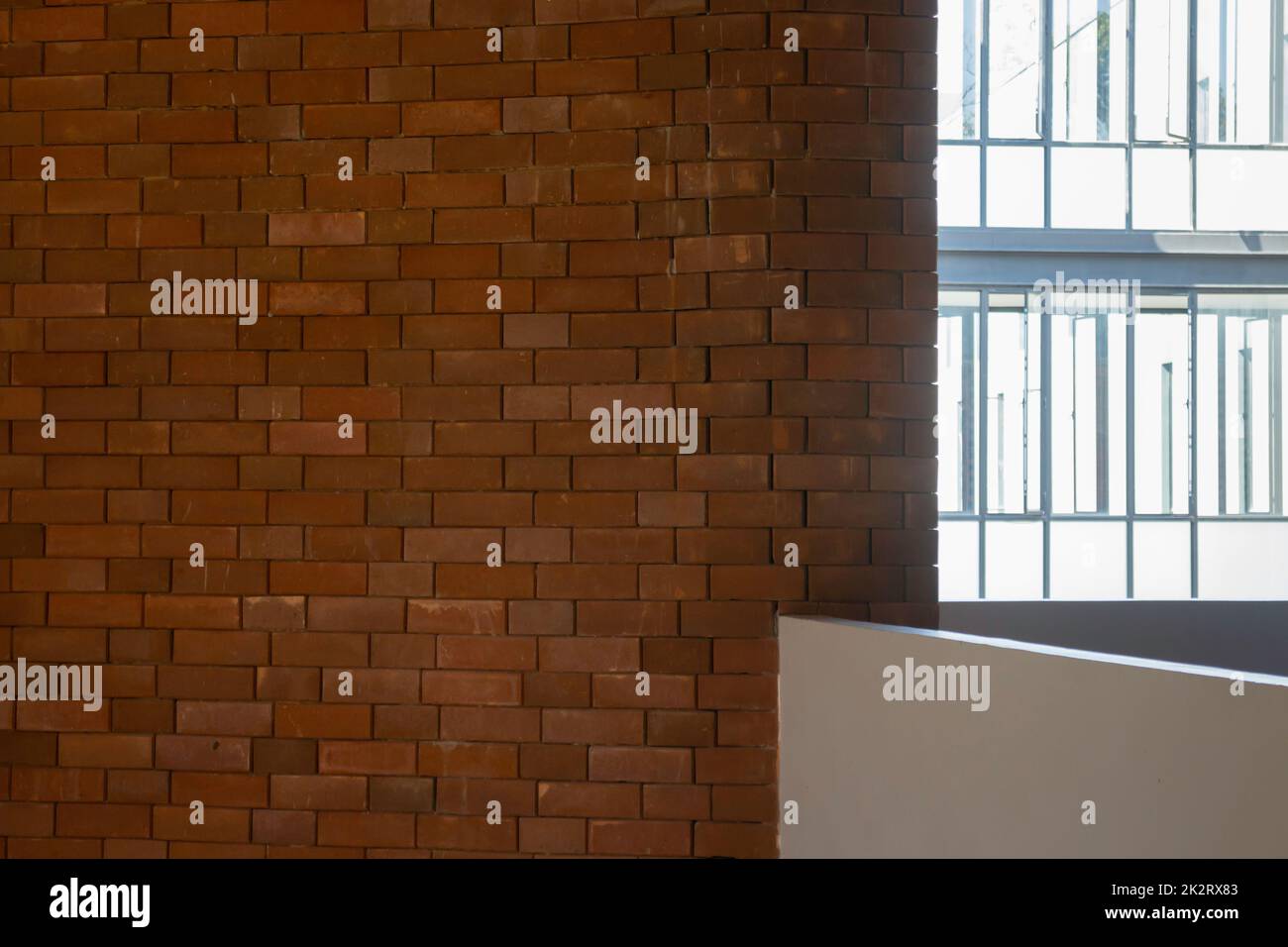 Brick wall trough to see light Stock Photo - Alamy
