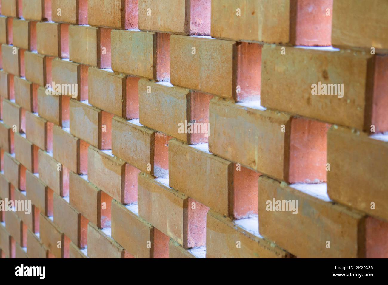 Brick wall trough to see light Stock Photo - Alamy