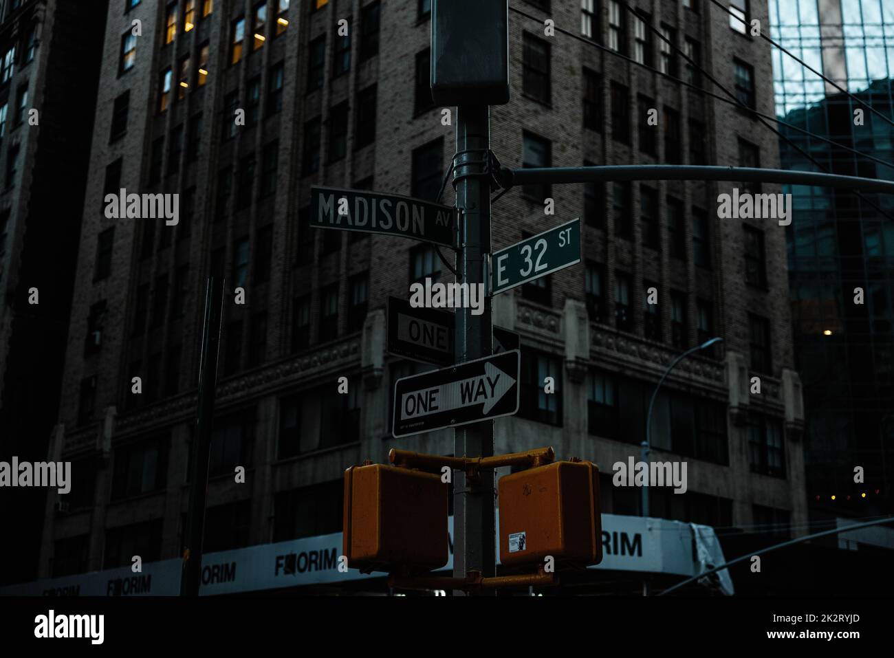 A closeup of street signs in background of buildings in New York Stock ...