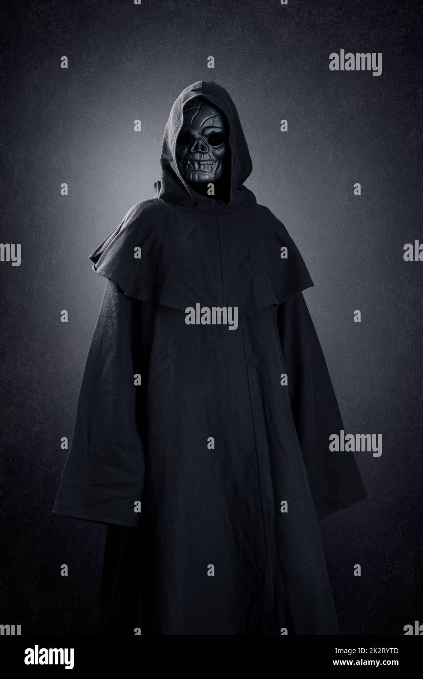 Grim reaper over dark misty background Stock Photo - Alamy