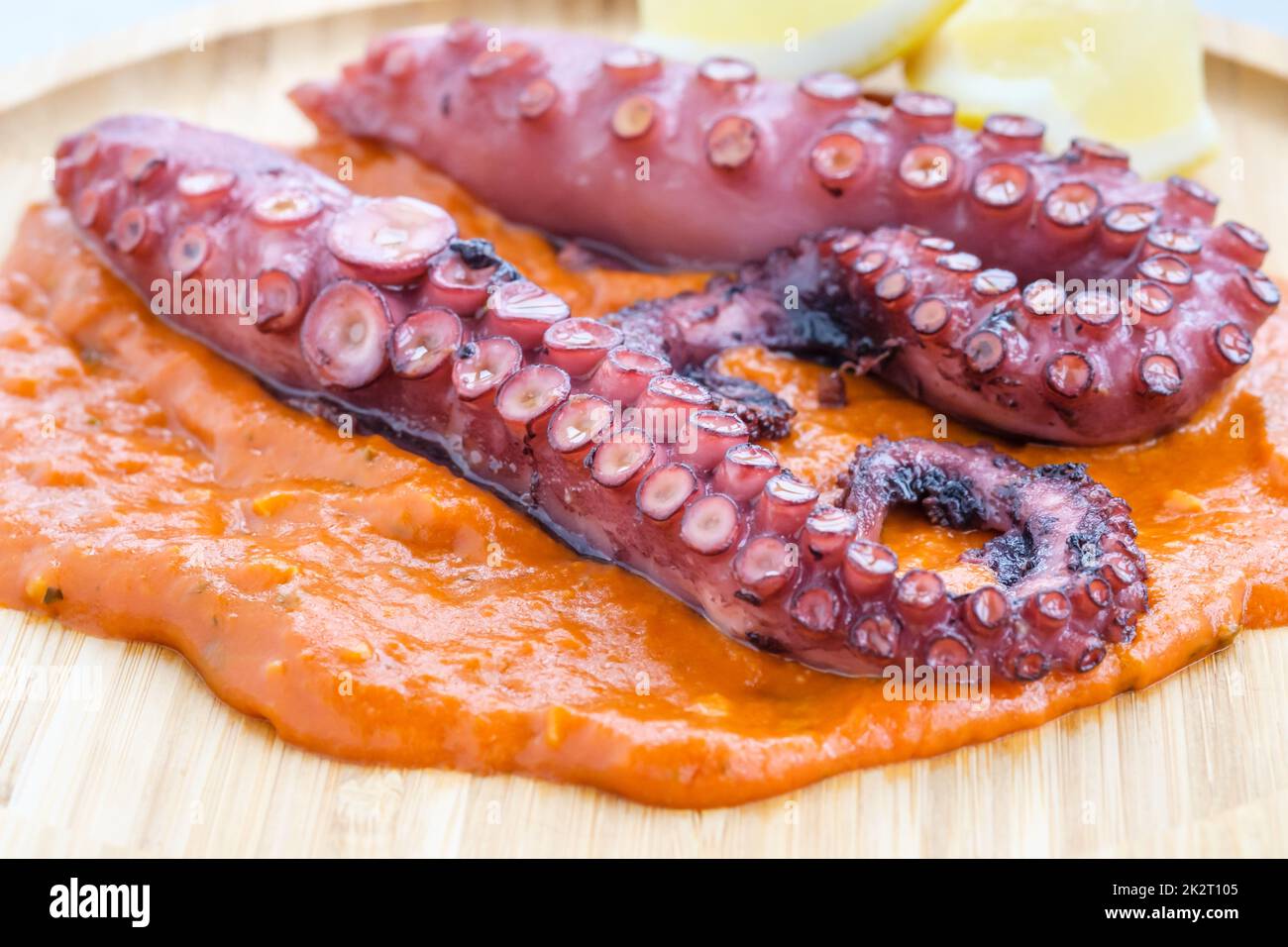 Octopus with romesco sauce Stock Photo - Alamy