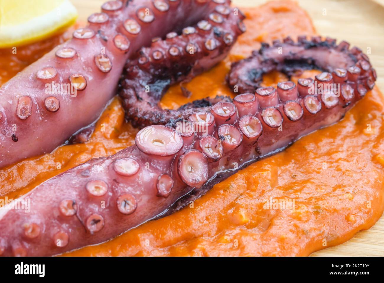 Octopus with romesco sauce Stock Photo - Alamy