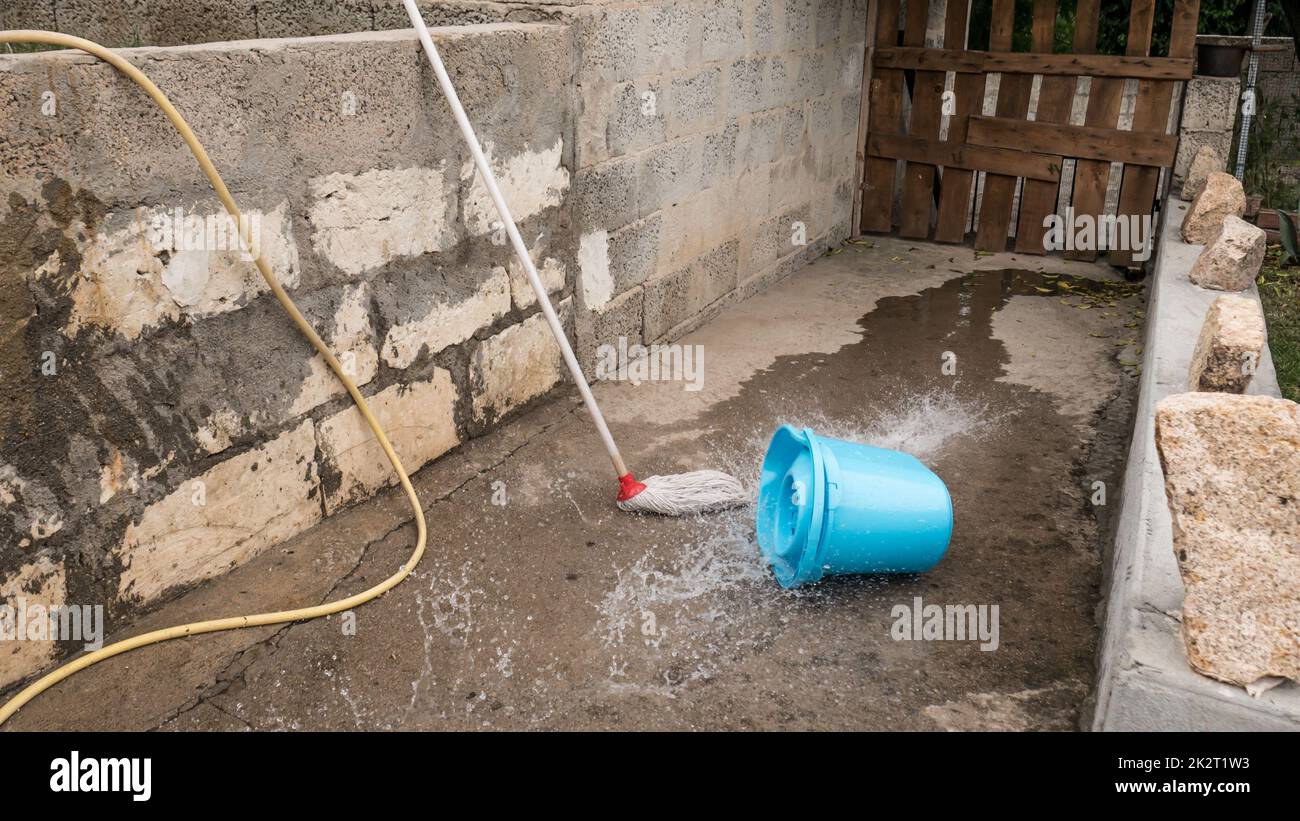mop with mop left on the ground that are flooded with, sprayed with a ...