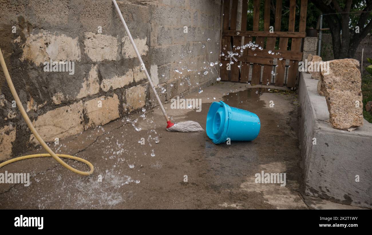 mop with mop left on the ground that are flooded with, sprayed with a ...