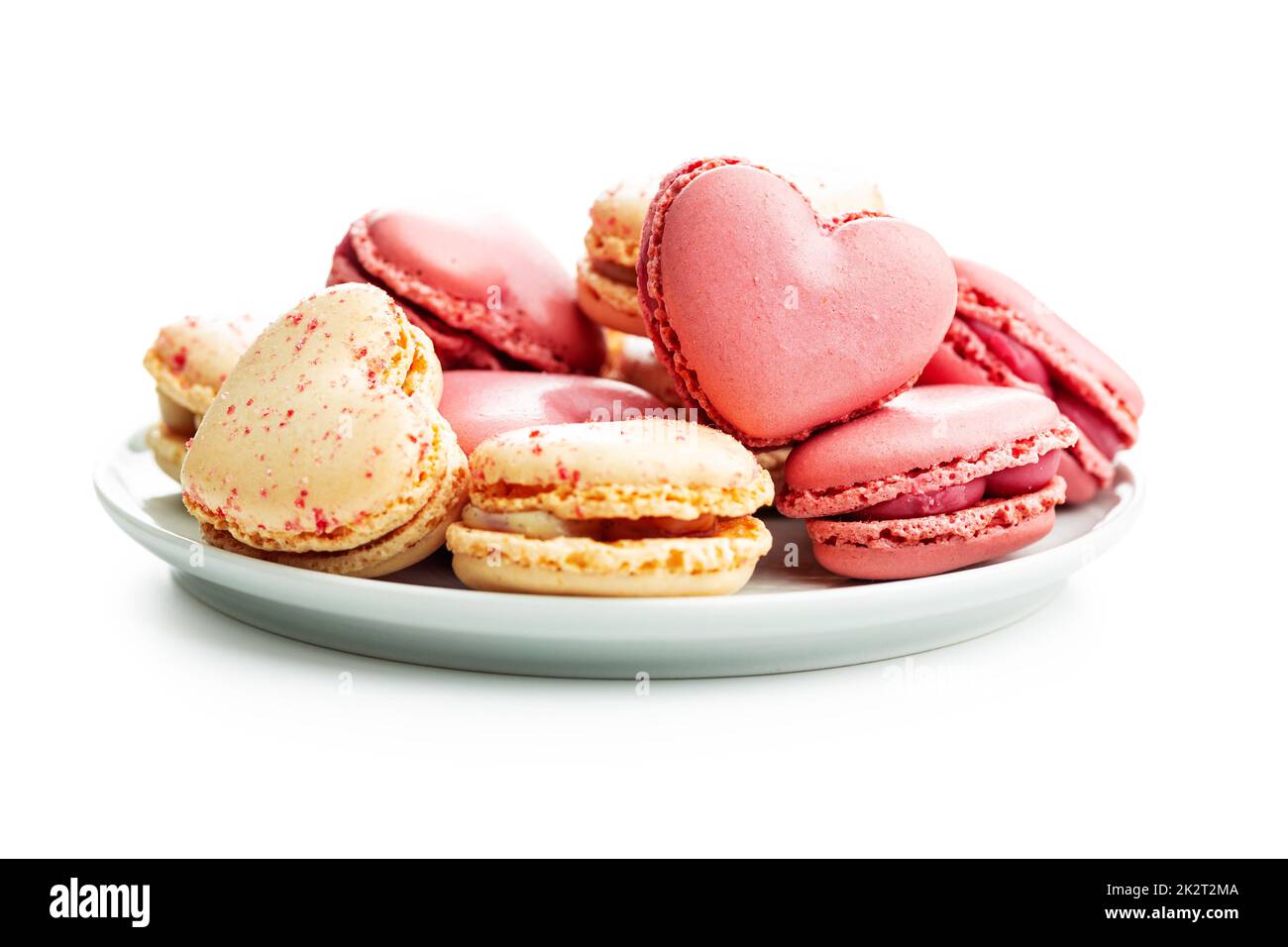 Heart shaped Sweet macarons on plate isolated on white background Stock ...
