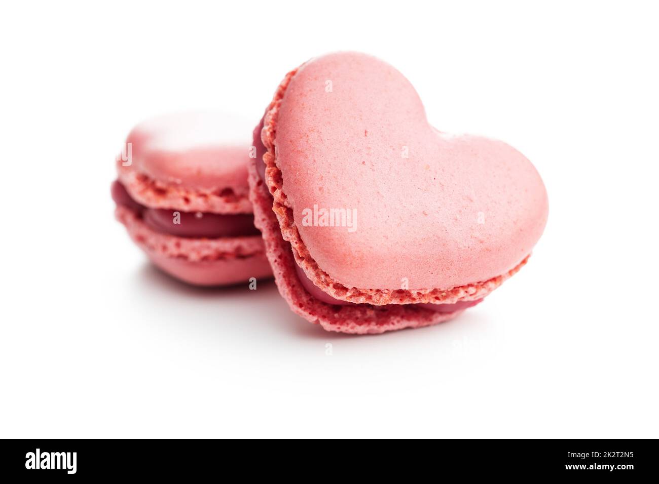 Heart shaped Sweet macarons isolated on white background Stock Photo ...