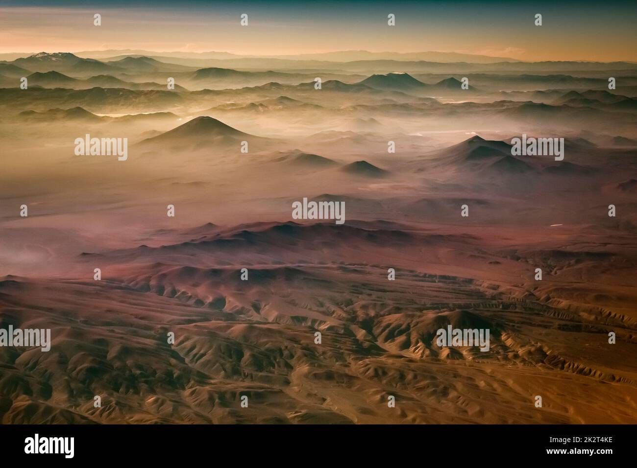 Aerial Atacama desert, snowcapped volcanoes and arid landscape in Chile ...