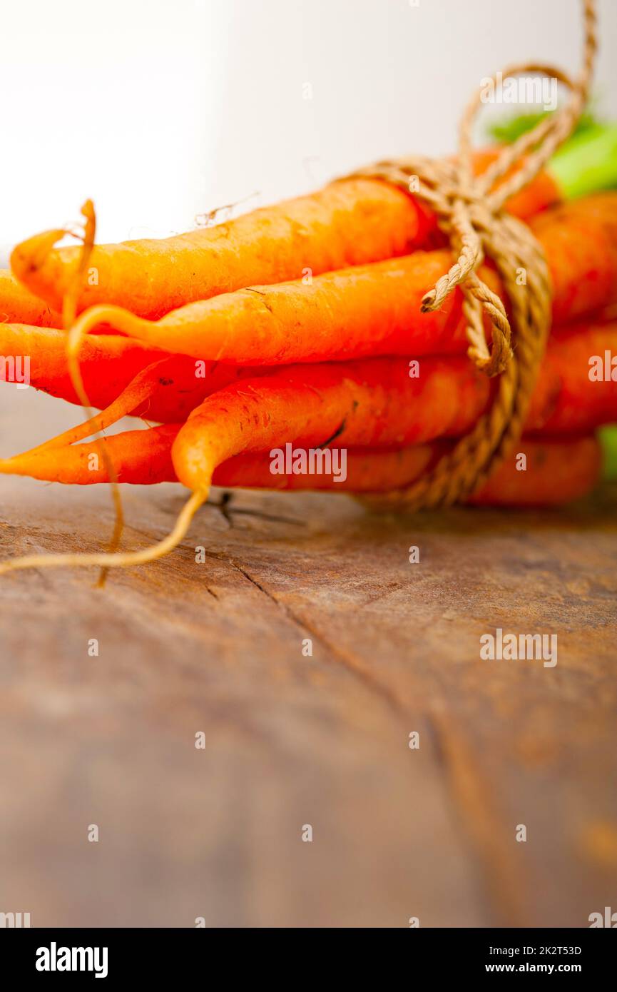 baby carrots bunch tied with rope Stock Photo - Alamy