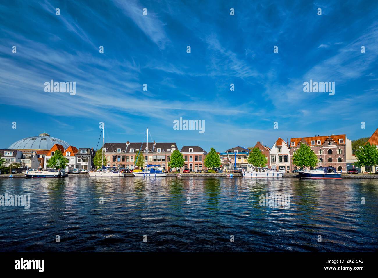 Boats and houses on Spaarne river. Haarlem, Netherlands Stock Photo - Alamy