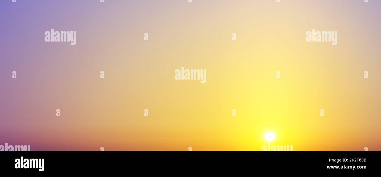 Beautiful big orange sun at sunset sky Stock Photo - Alamy