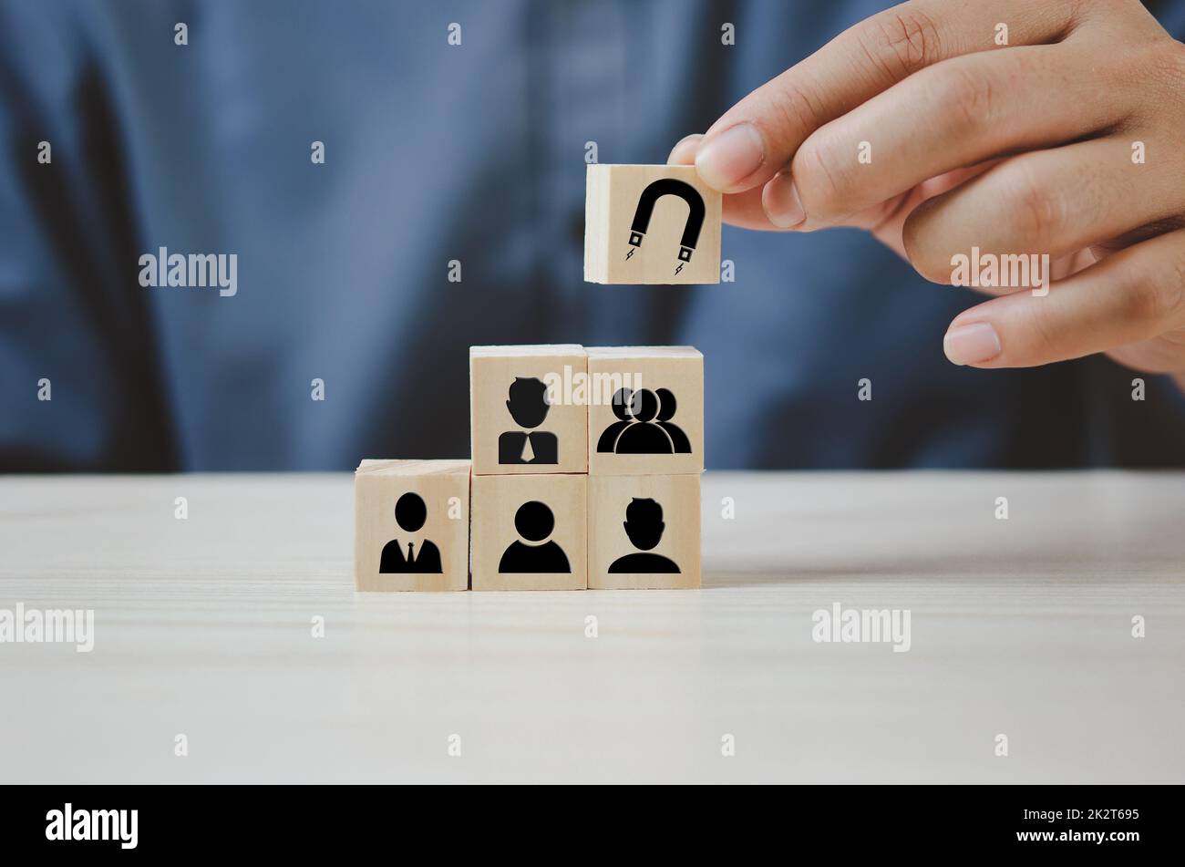 Hand put wooden cubes with Inbound marketing icons and symbols on table ...