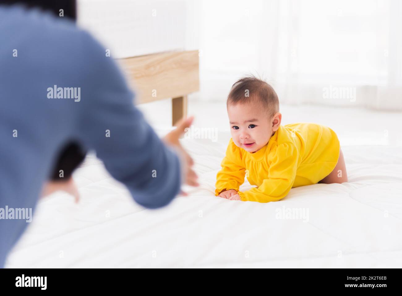 mother have fun learn walking crawling his daughter baby indoors ...