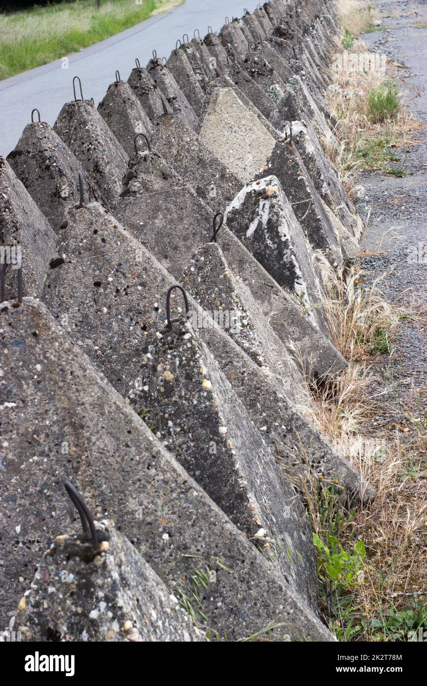 Reinforced concrete anti-tank barrier Stock Photo - Alamy