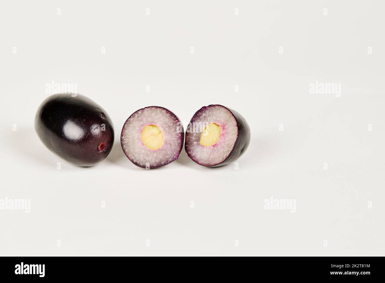 Whole and cut Jambolan plum or Java plum or Jamun fruit on white Stock ...