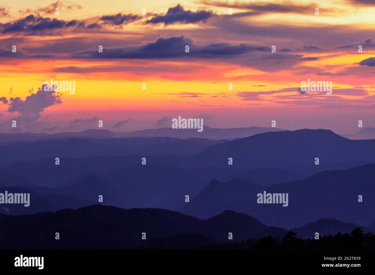 Sunset in hills Stock Photo - Alamy