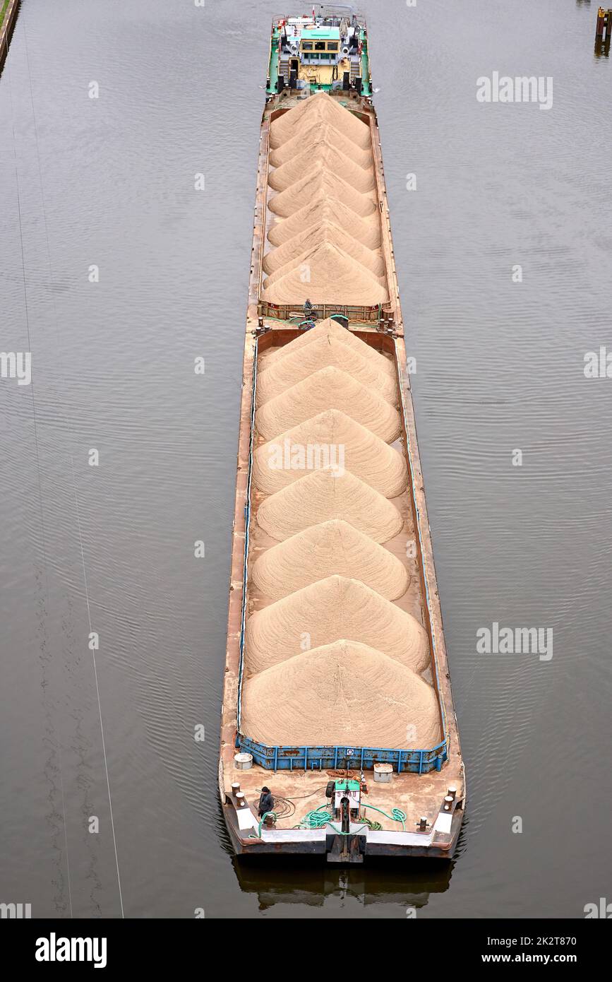vessel transporting gravel sand on a river Stock Photo - Alamy