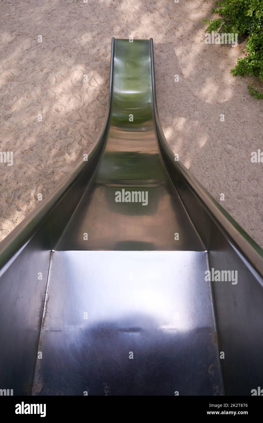 empty metal slide on playground Stock Photo - Alamy