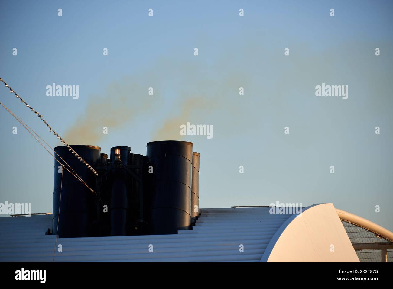 smoking chimney of an ordinary cruise ship Stock Photo - Alamy