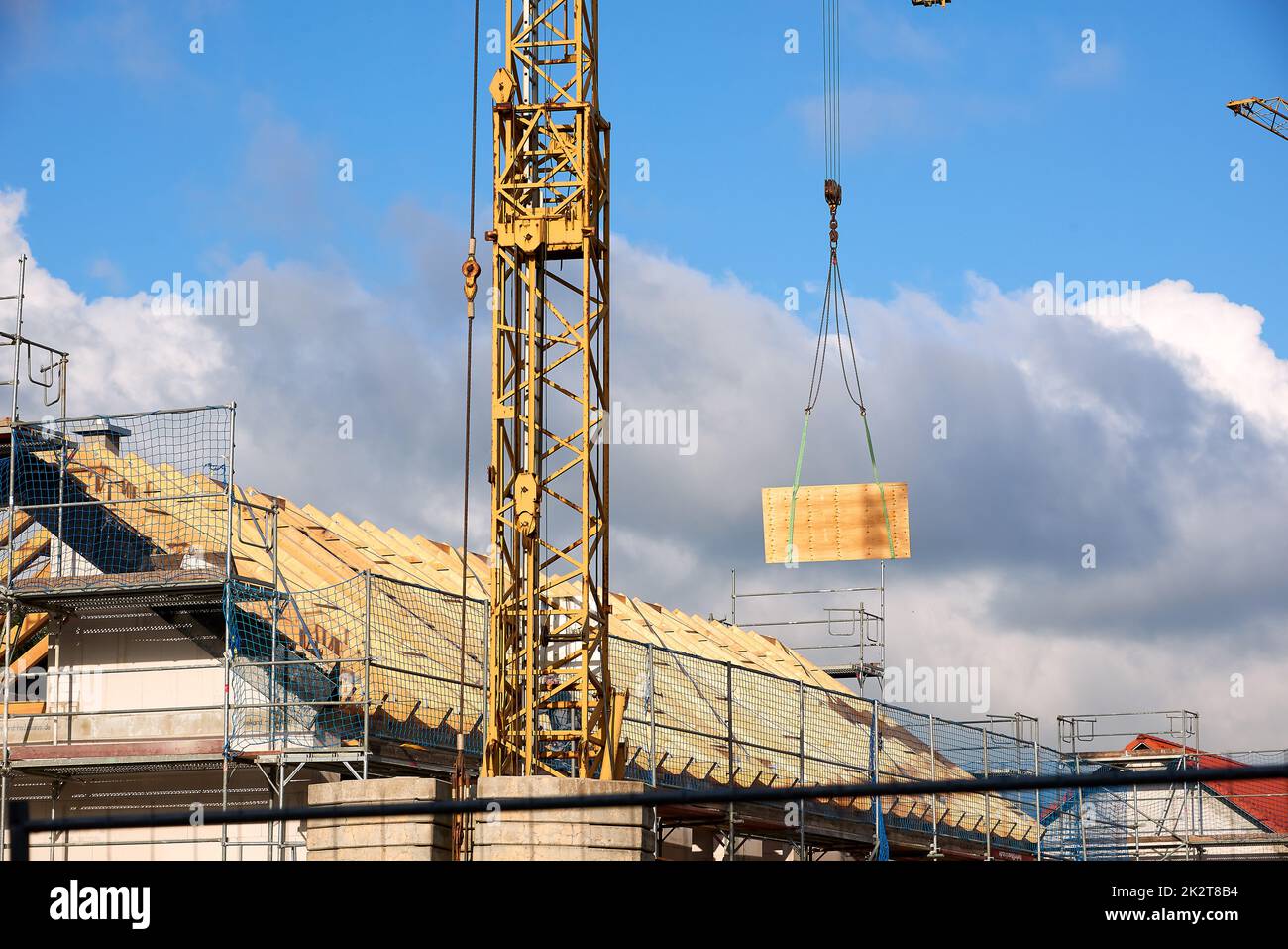 Crane working on construction site Stock Photo - Alamy
