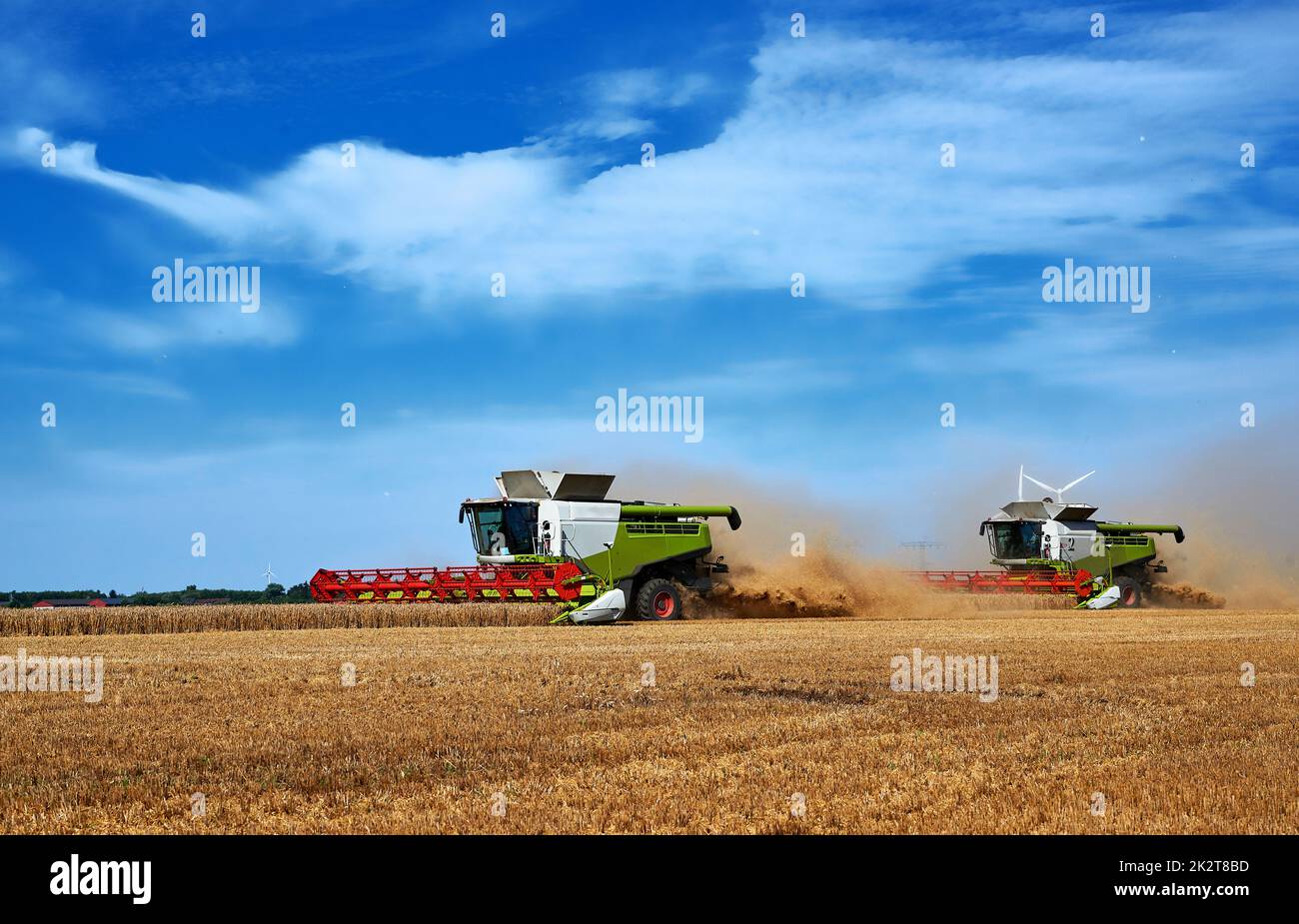 Combine harvester work on golden hi-res stock photography and images ...
