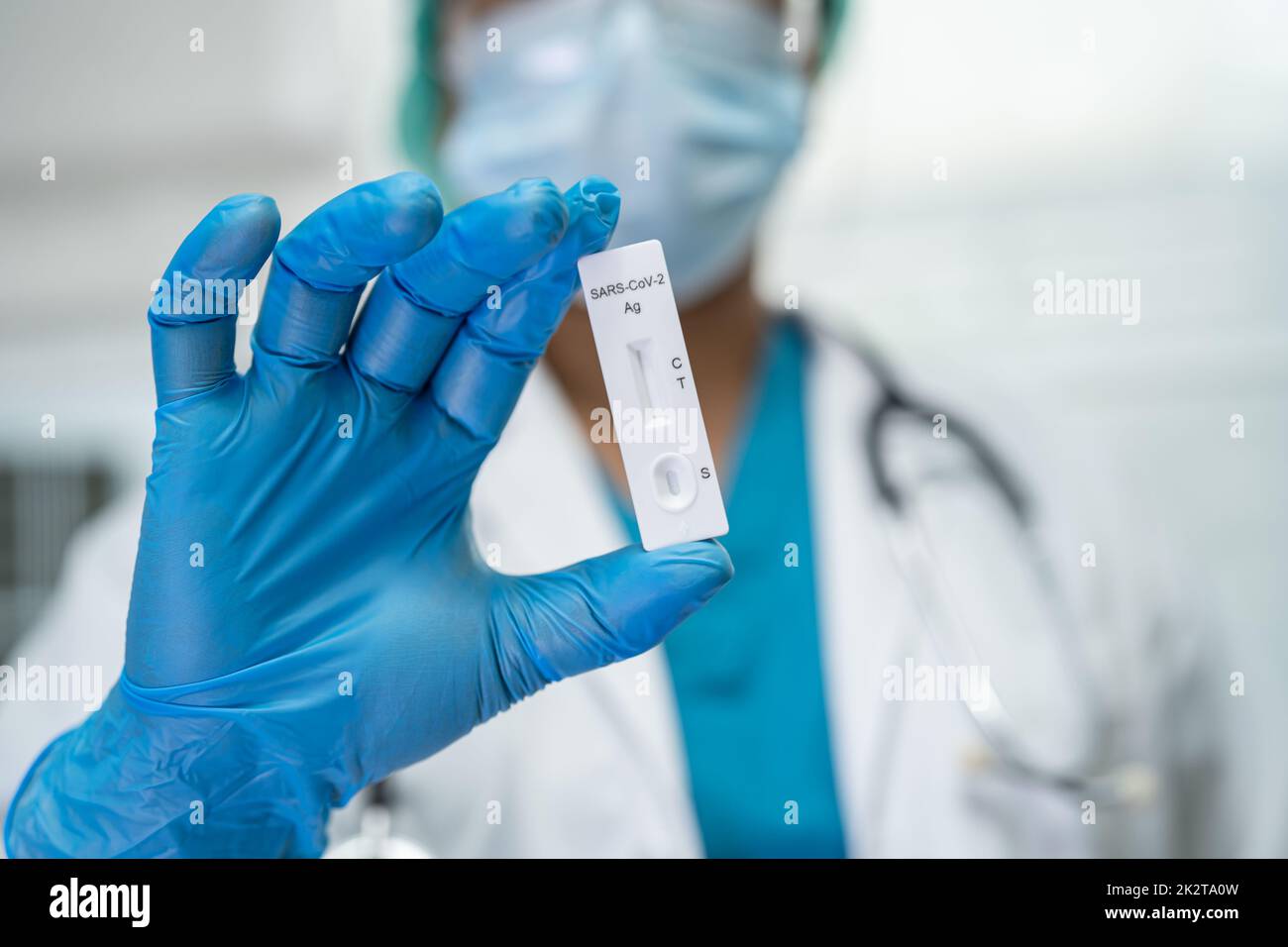 Asian doctor in PPE suit show positive test result with Saliva Antigen ...