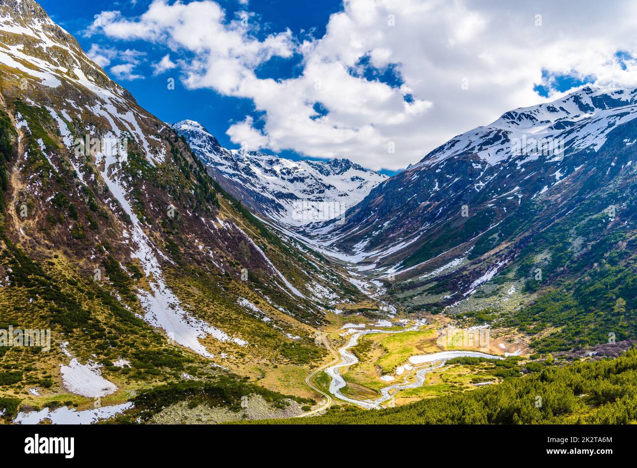 Mountain river in Alps covered with snow, Fluelapass, Zernez, Gr Stock ...
