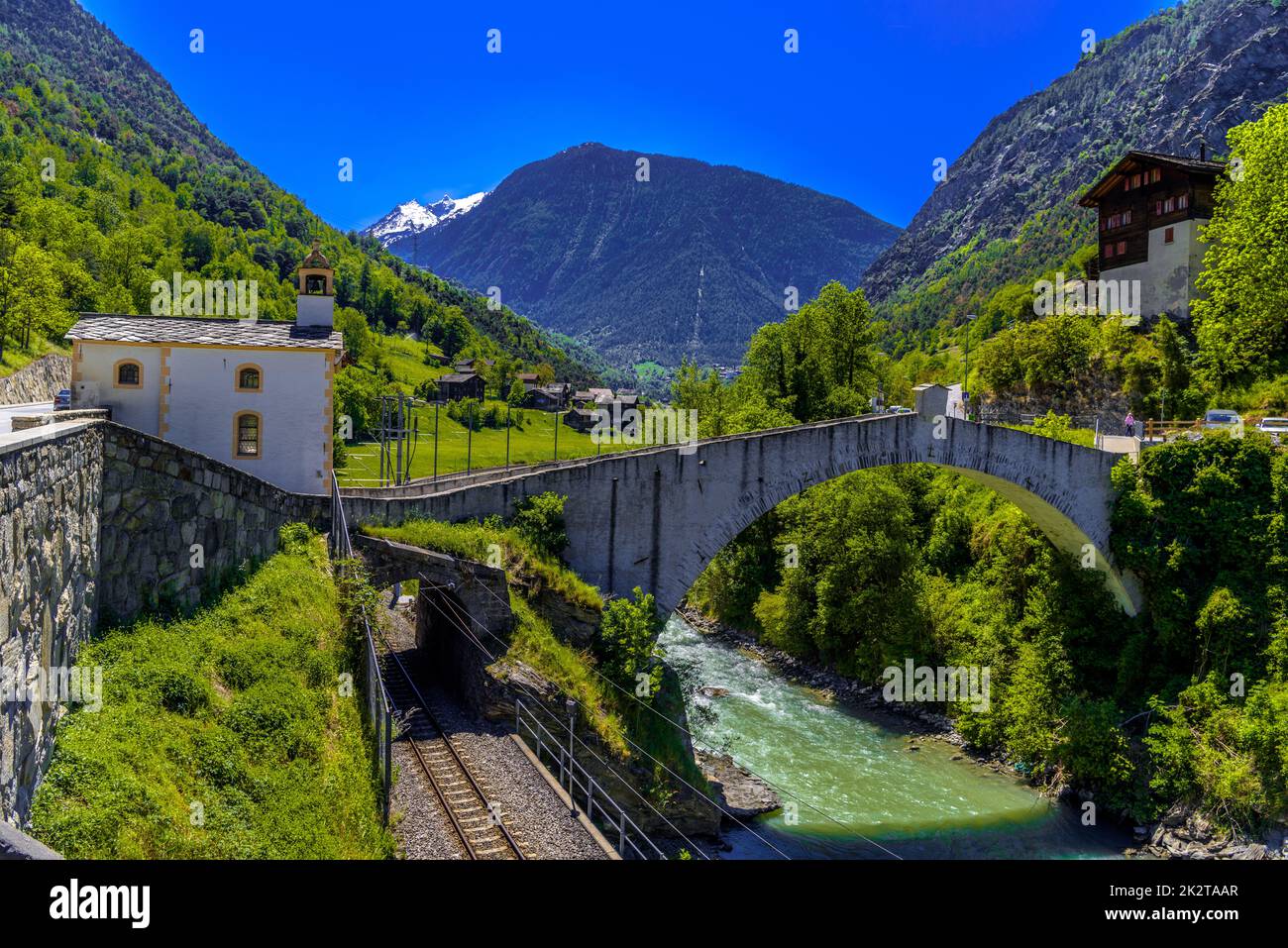Ancient stone bridge over the moutnain river in Swiss Alps, Stal Stock ...