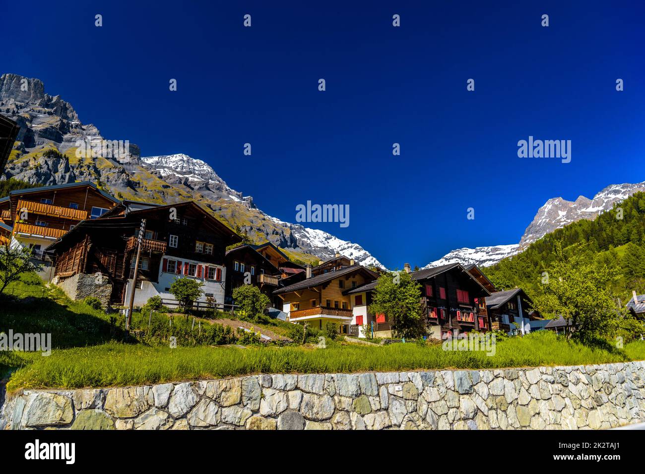 Chalet and hotels in swiss village in Alps, Leukerbad, Leuk, Vis Stock ...