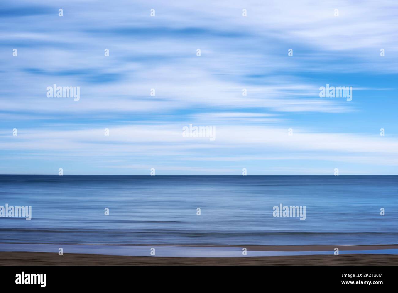 Background of a beach and sky with clouds Stock Photo - Alamy