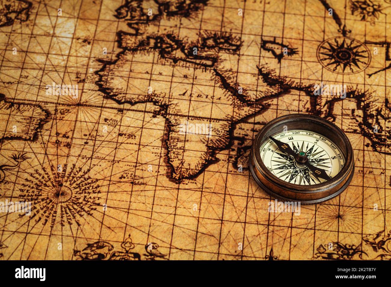 Old vintage compass on ancient map Stock Photo - Alamy