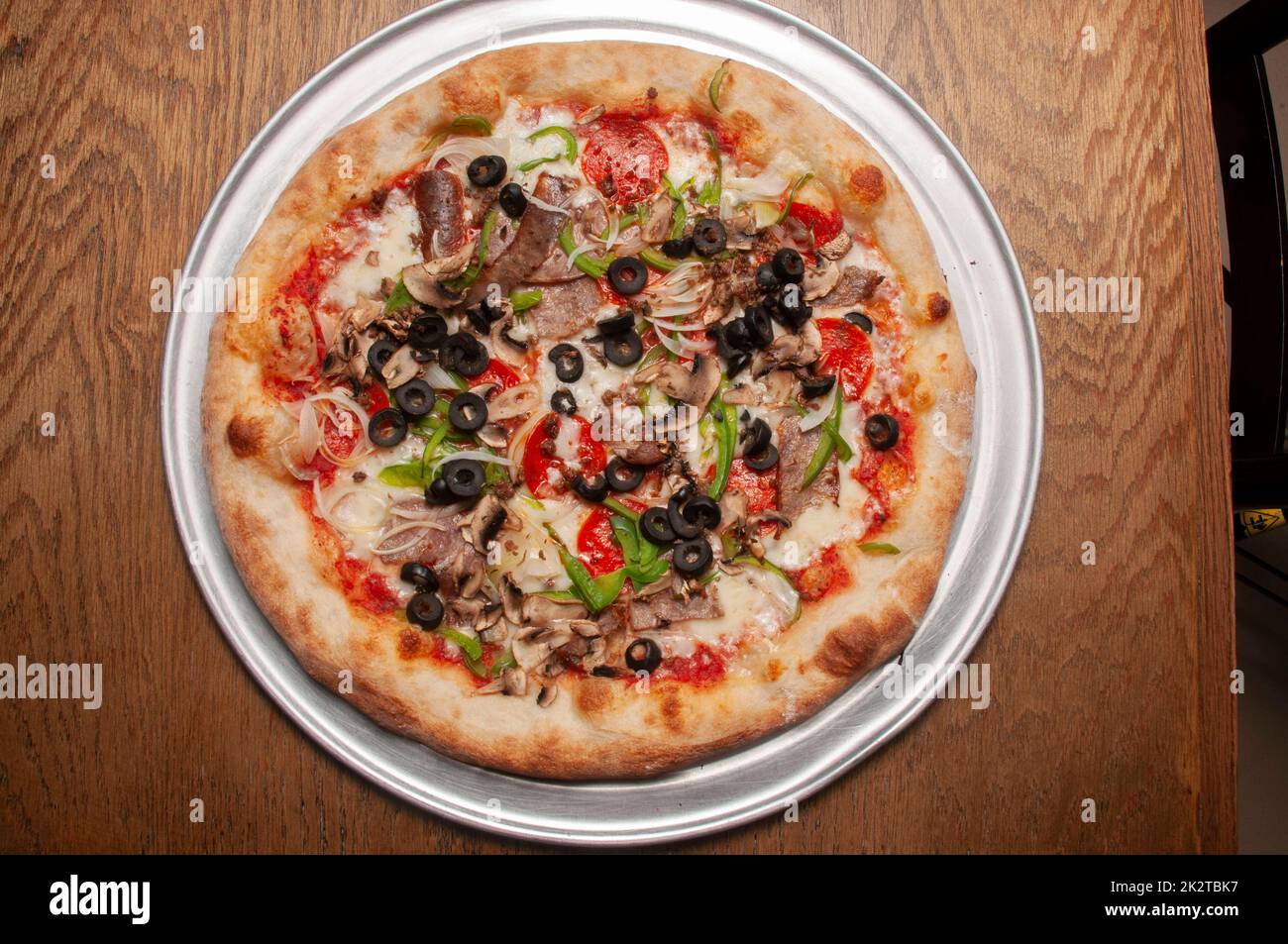 Delicious Italian Pizza Supreme Stock Photo - Alamy