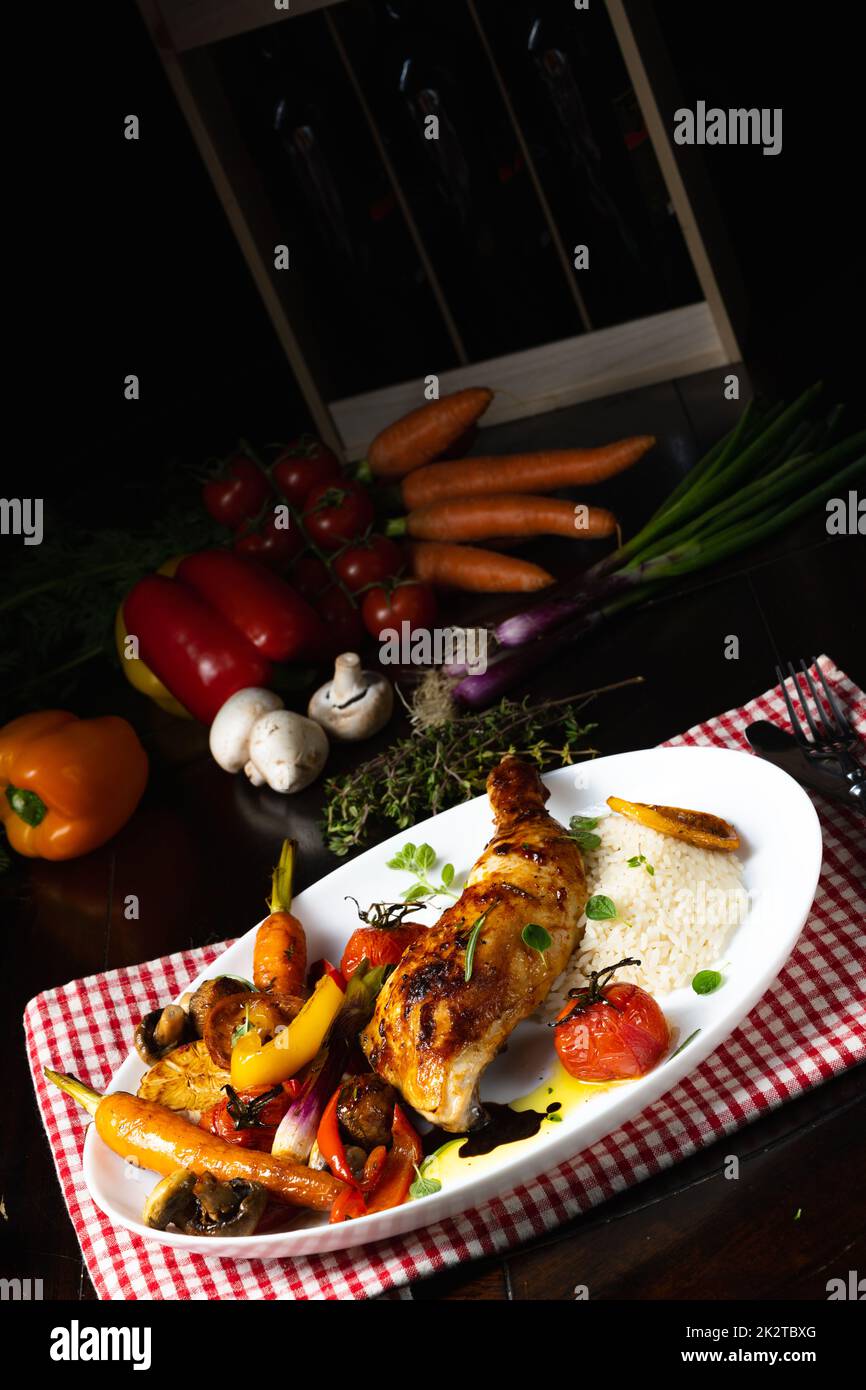 Rustic fried chicken legs with assorted vegetables and rice Stock Photo ...