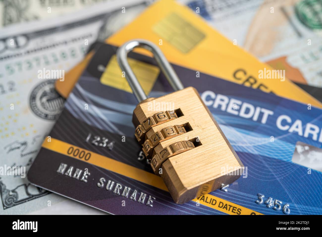 Credit card with password key lock security on US dollar background ...