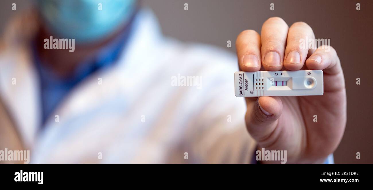 Positive test result by using rapid test device for COVID-19 Stock ...