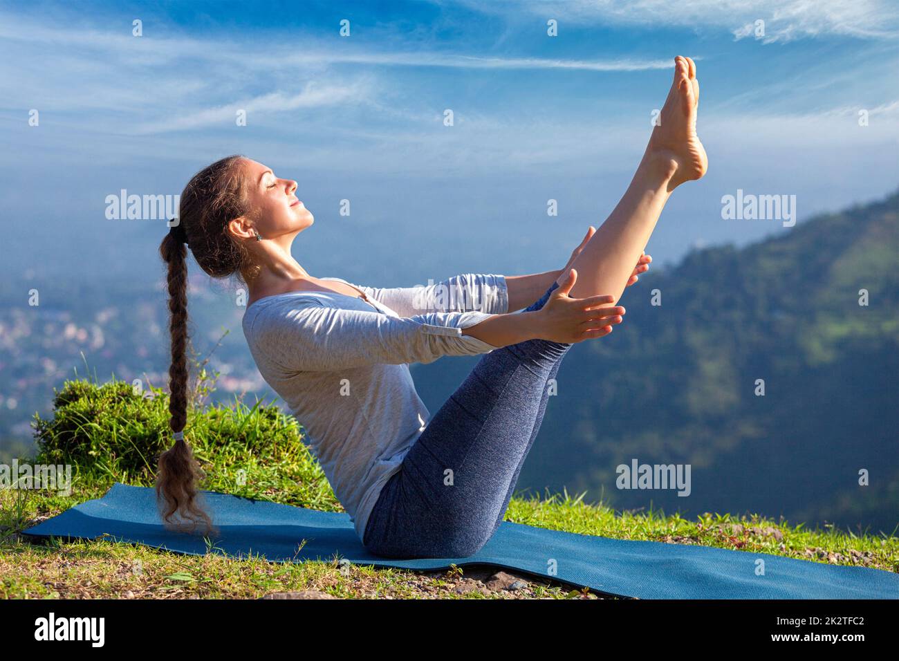 Woman Doing Ashtanga Vinyasa Yoga Asana Navasana Boat Pose Stock