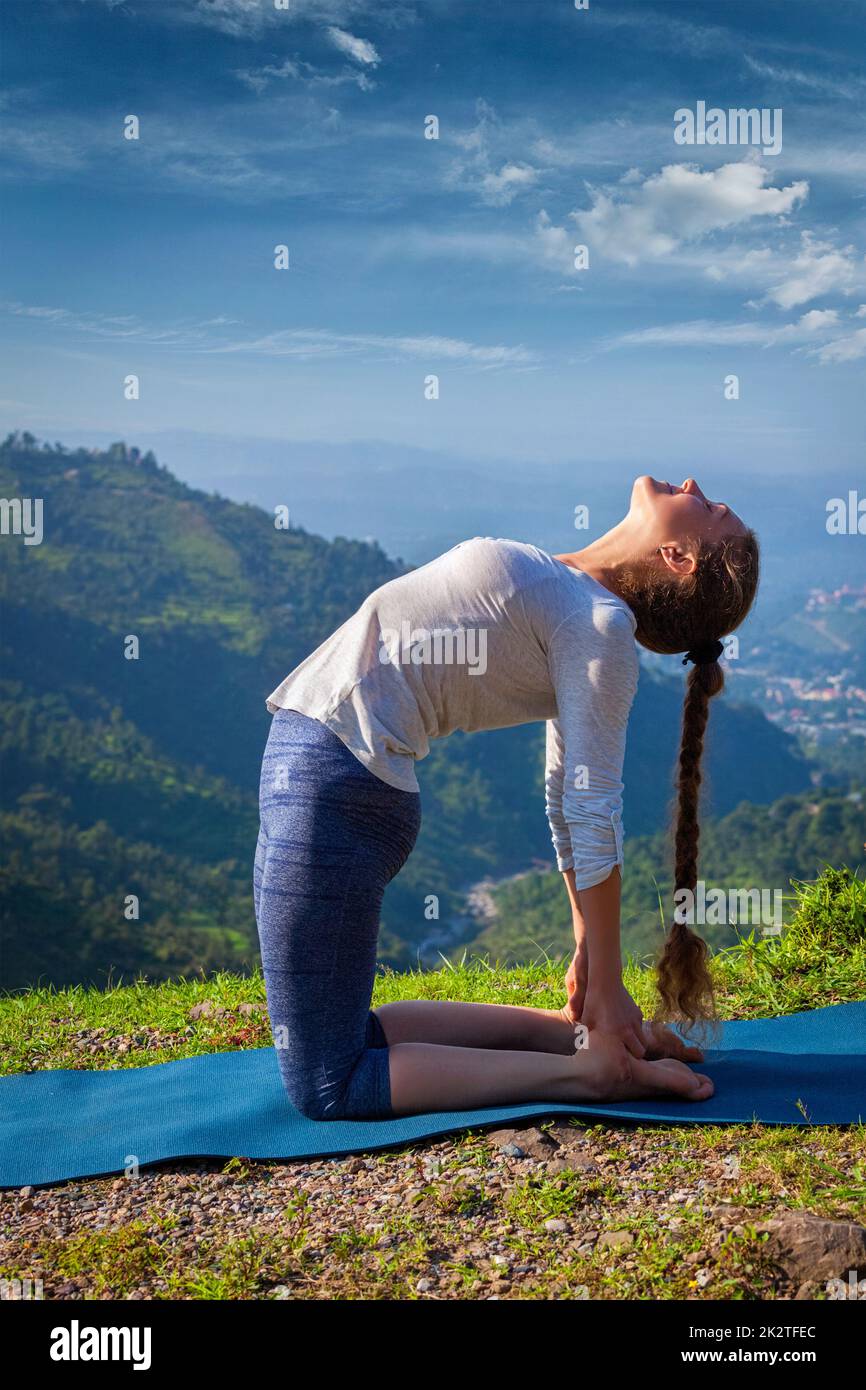 Woman doing yoga asana Ustrasana camel pose outdoors Stock Photo - Alamy