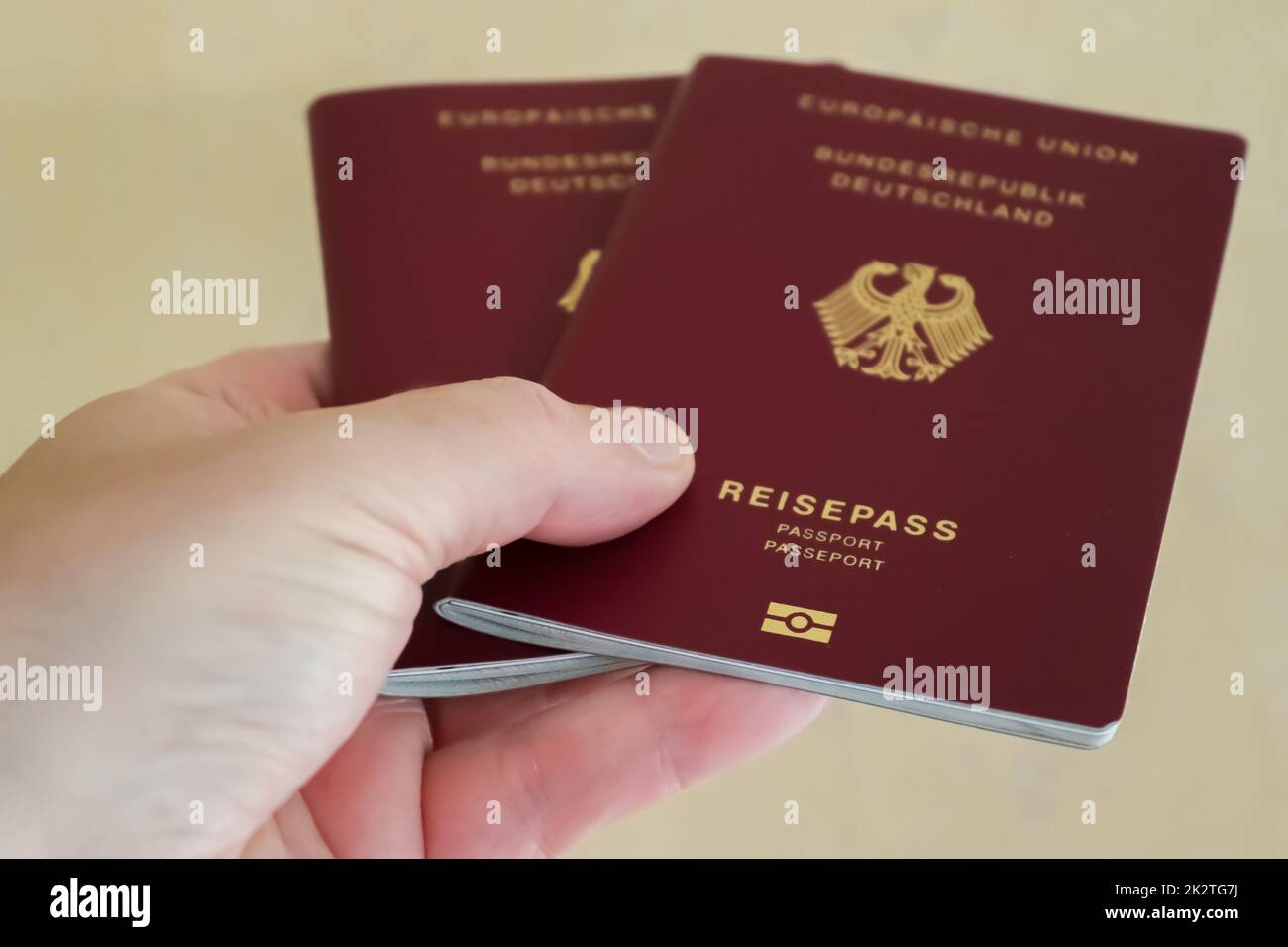 A male hand holds two German passports for passport control Stock Photo ...