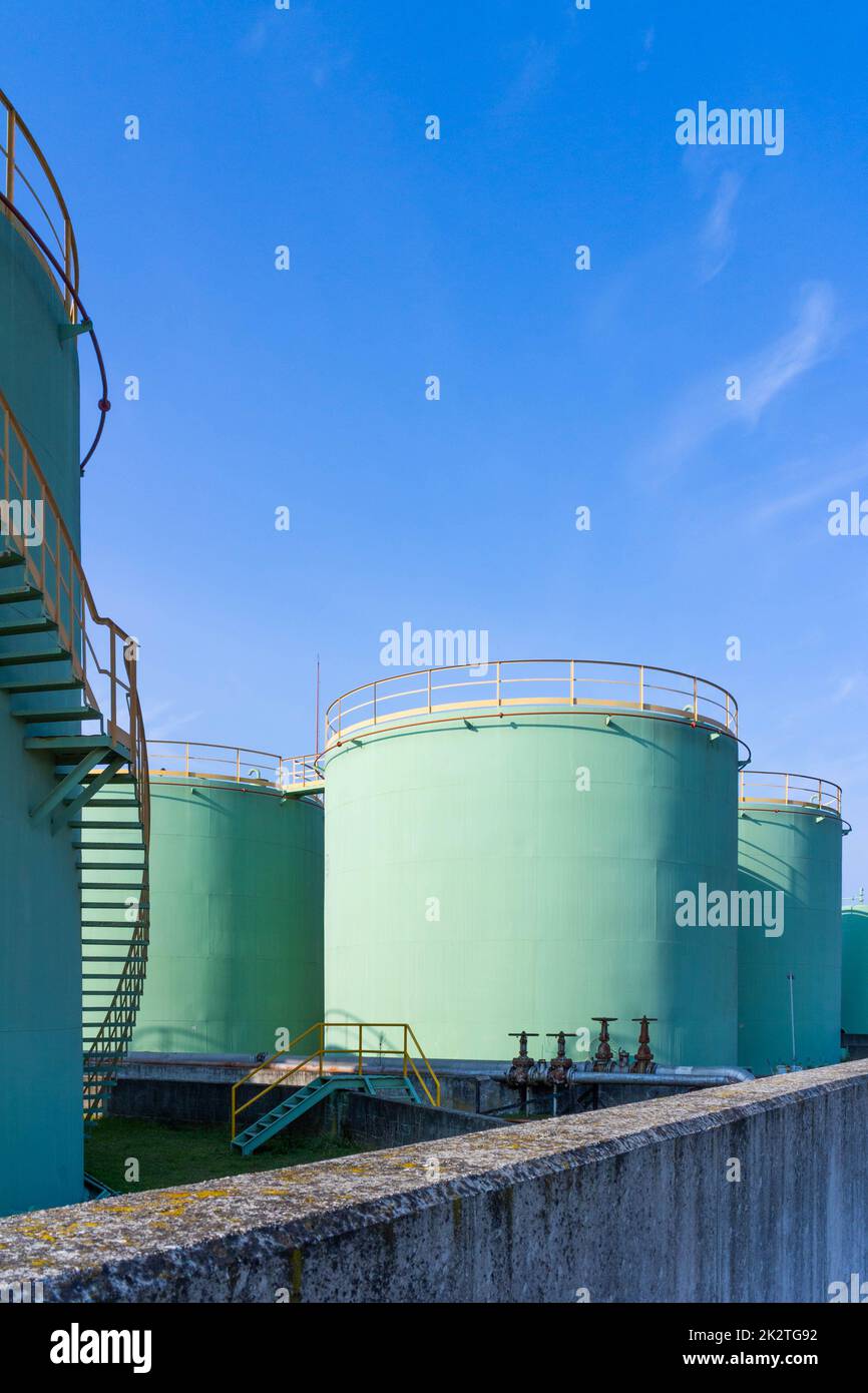 View of storage tank and pipes of chemical industry, Italy Stock Photo ...