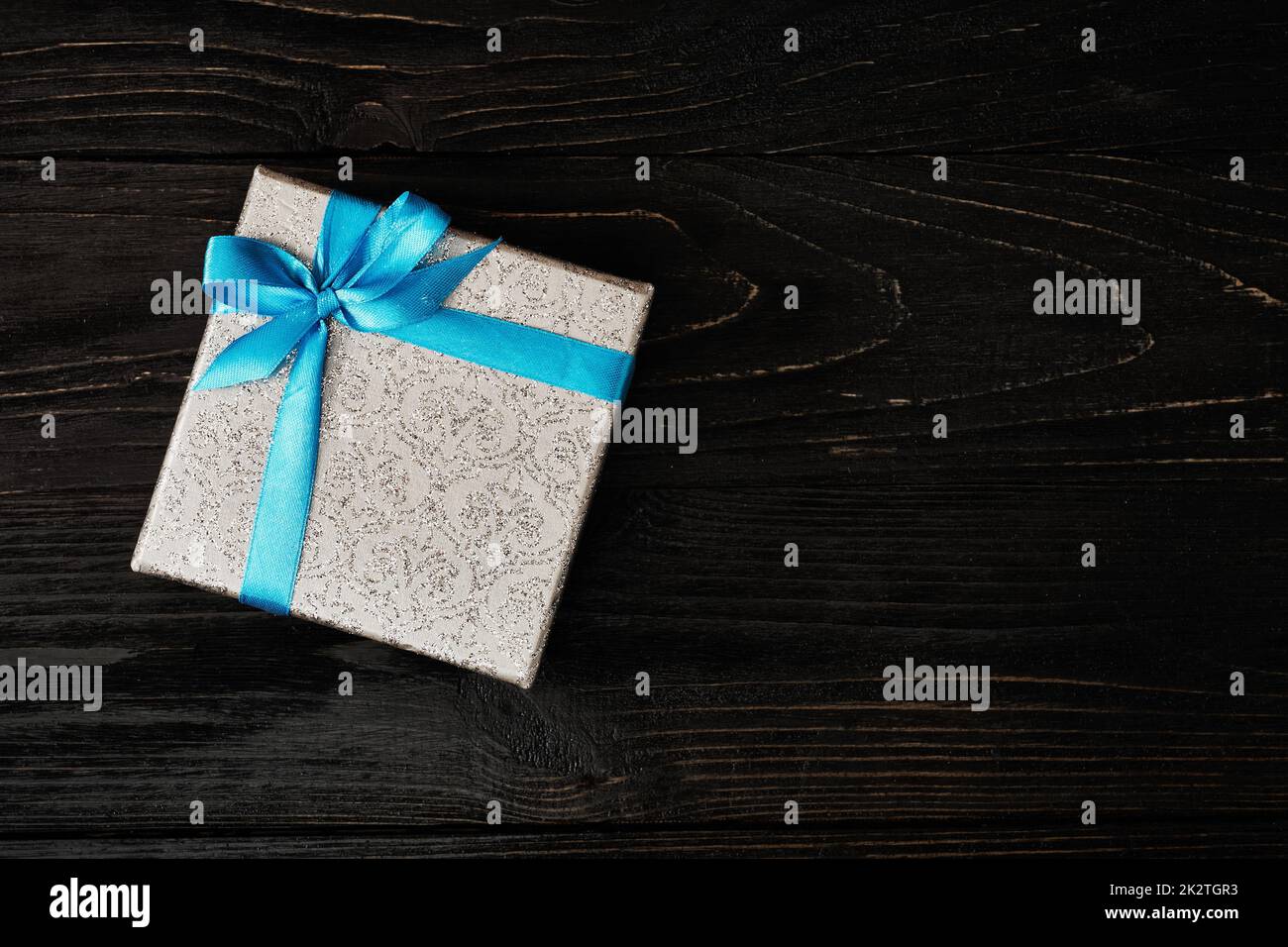 Gift box with red ribbon Stock Photo - Alamy