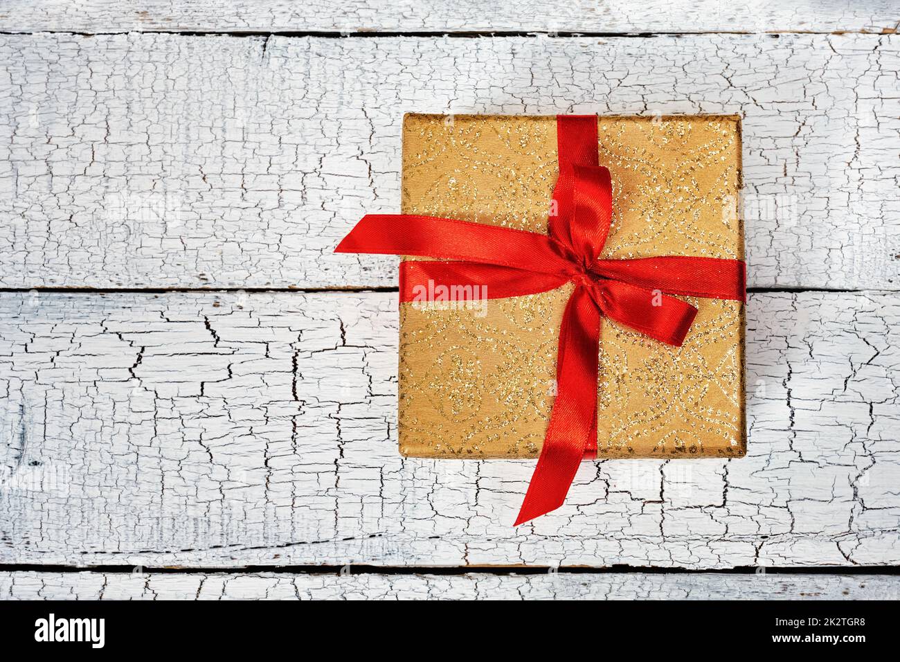 Gift box with red ribbon Stock Photo - Alamy