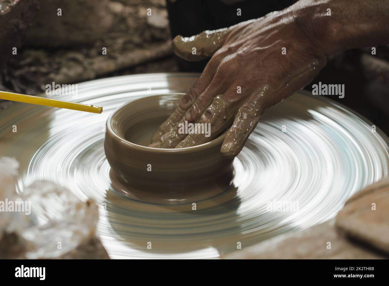 Making pottery by hand to make a container Stock Photo - Alamy