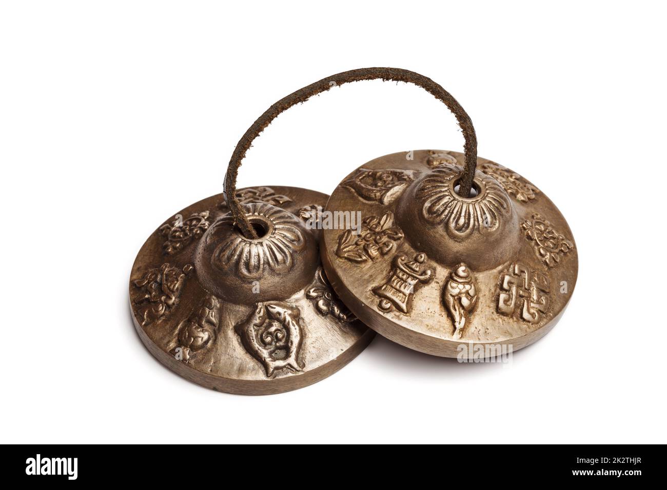 Tibetan Buddhist tingsha cymbals isolated Stock Photo - Alamy