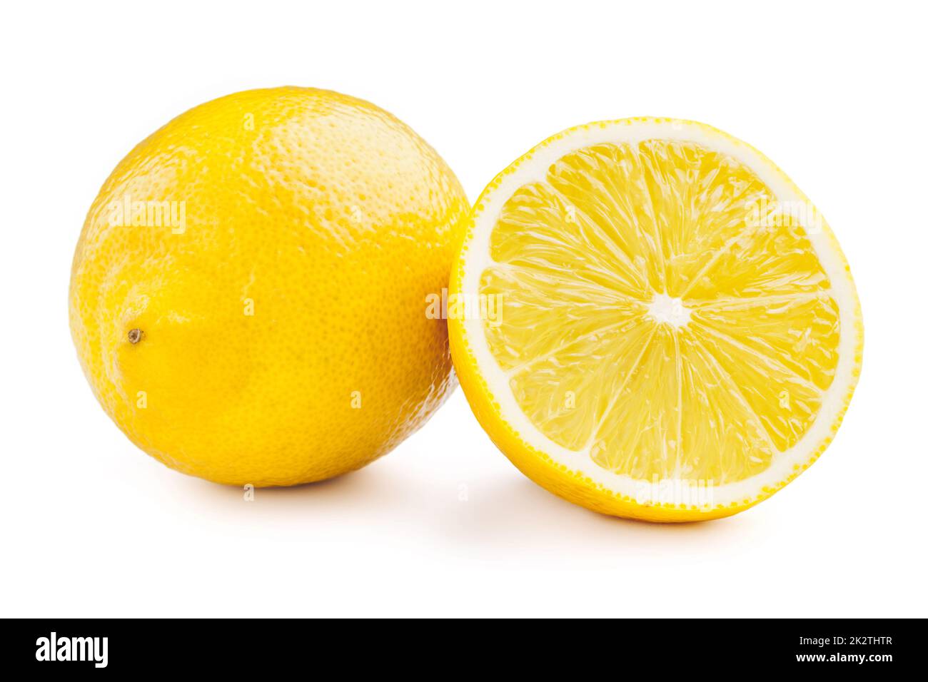 Lemon and cut half slice isolated Stock Photo - Alamy