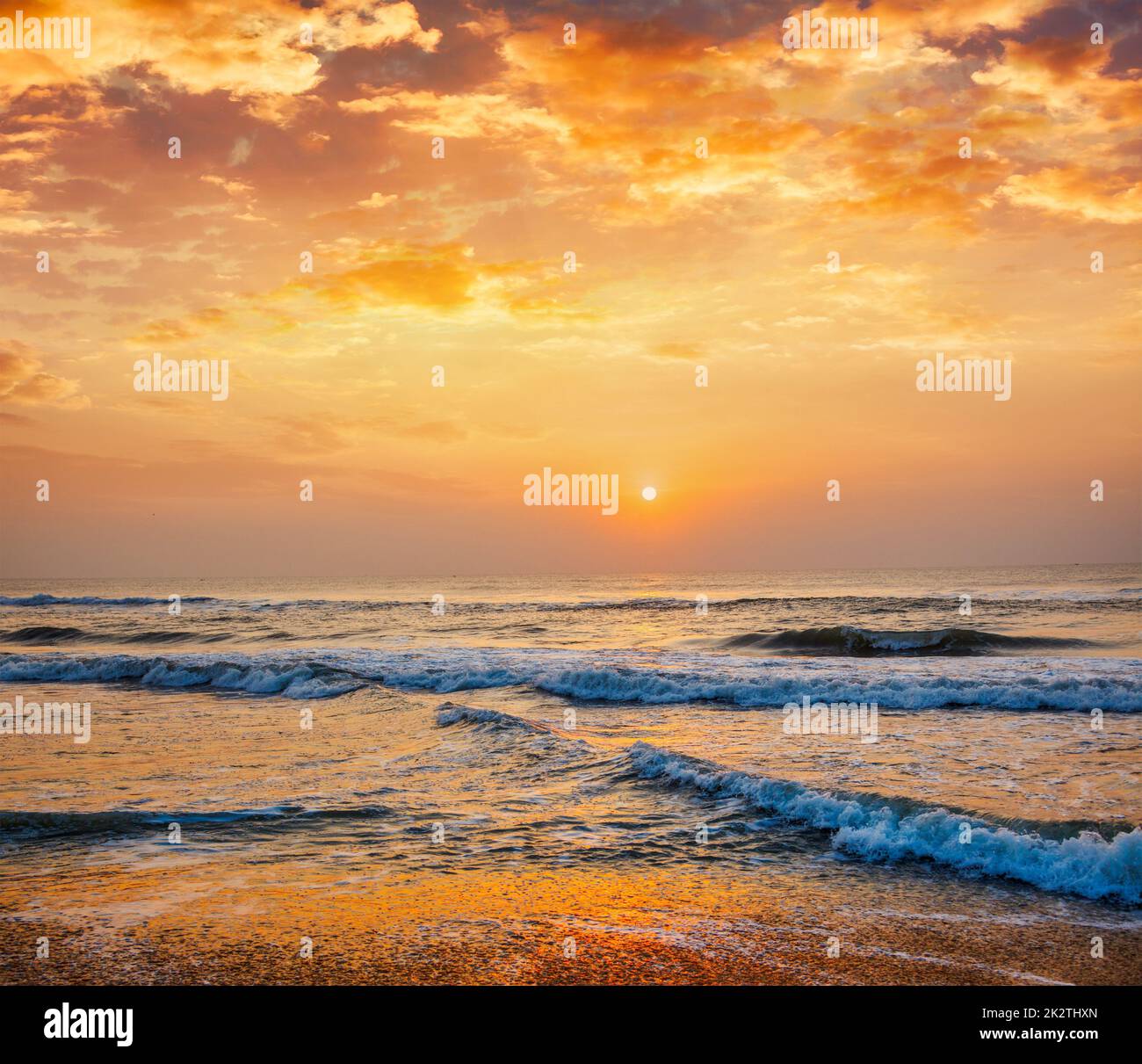 Sunrise on beach Stock Photo - Alamy