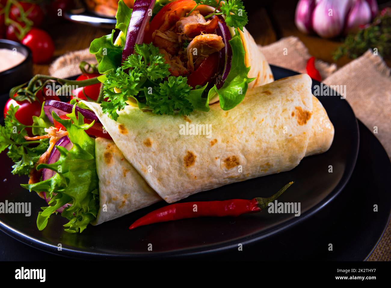 tasty pulled pork wrap with vegetables Stock Photo - Alamy
