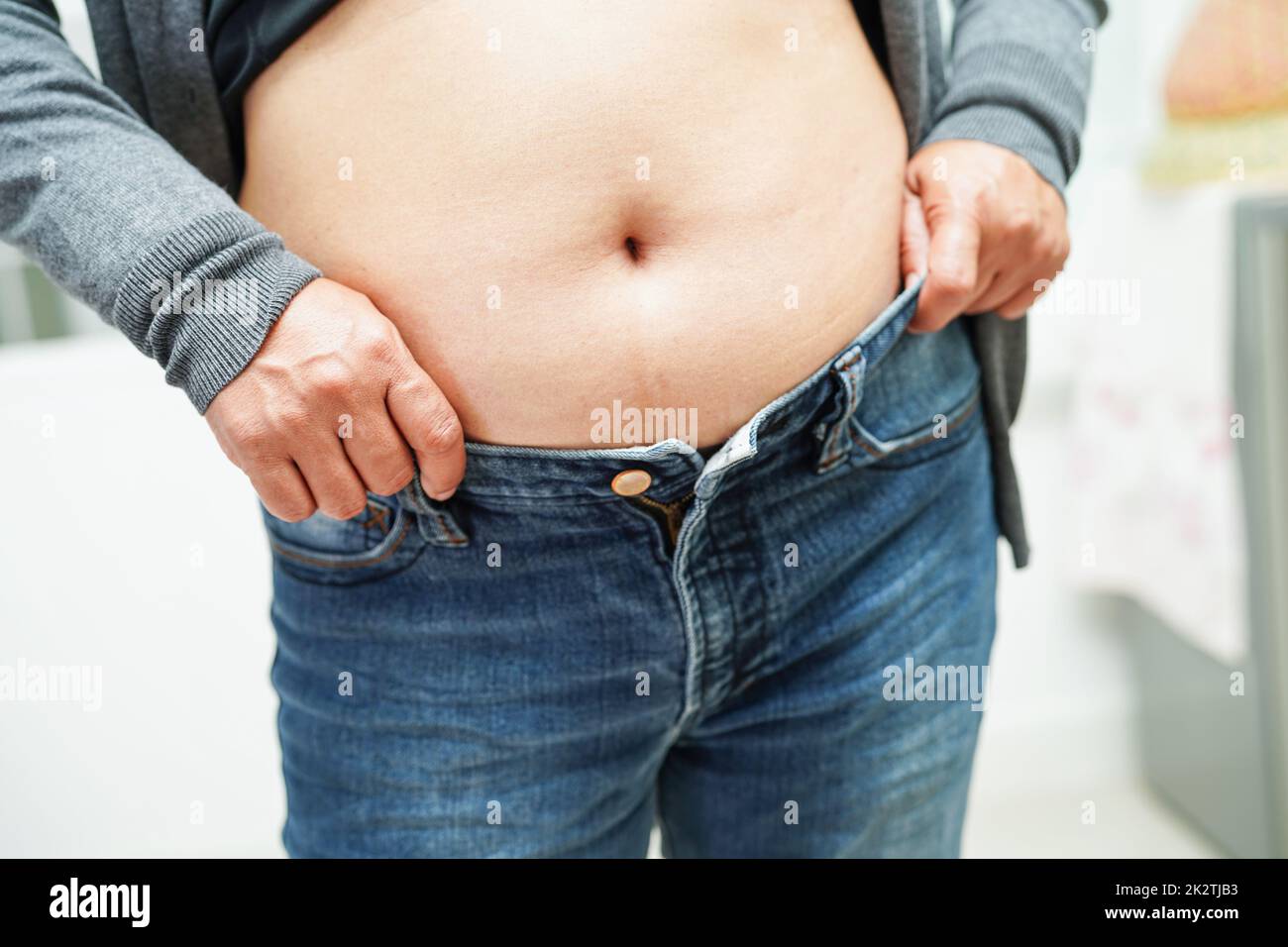 Asian woman show fat belly big size overweight and obesity at office ...