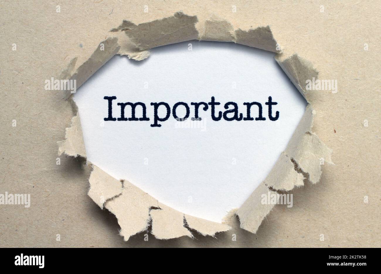 Important text on paper hole Stock Photo - Alamy